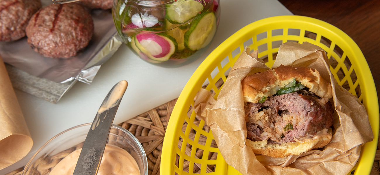 Make these boudin-stuffed sliders with Cajun burger sauce for upcoming ...